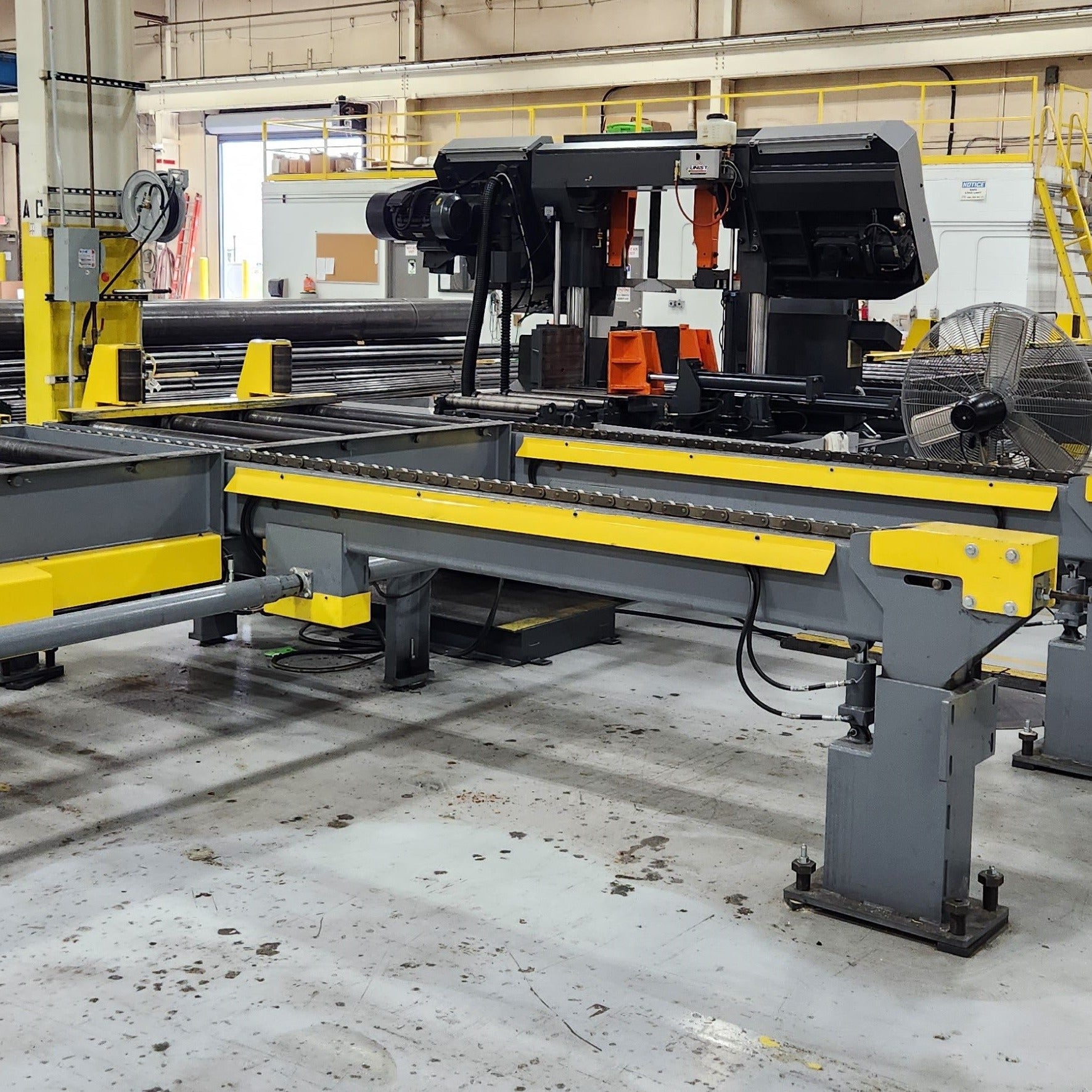 Two Saw system with powered lift transfer arms – Bad Ass Band Saws