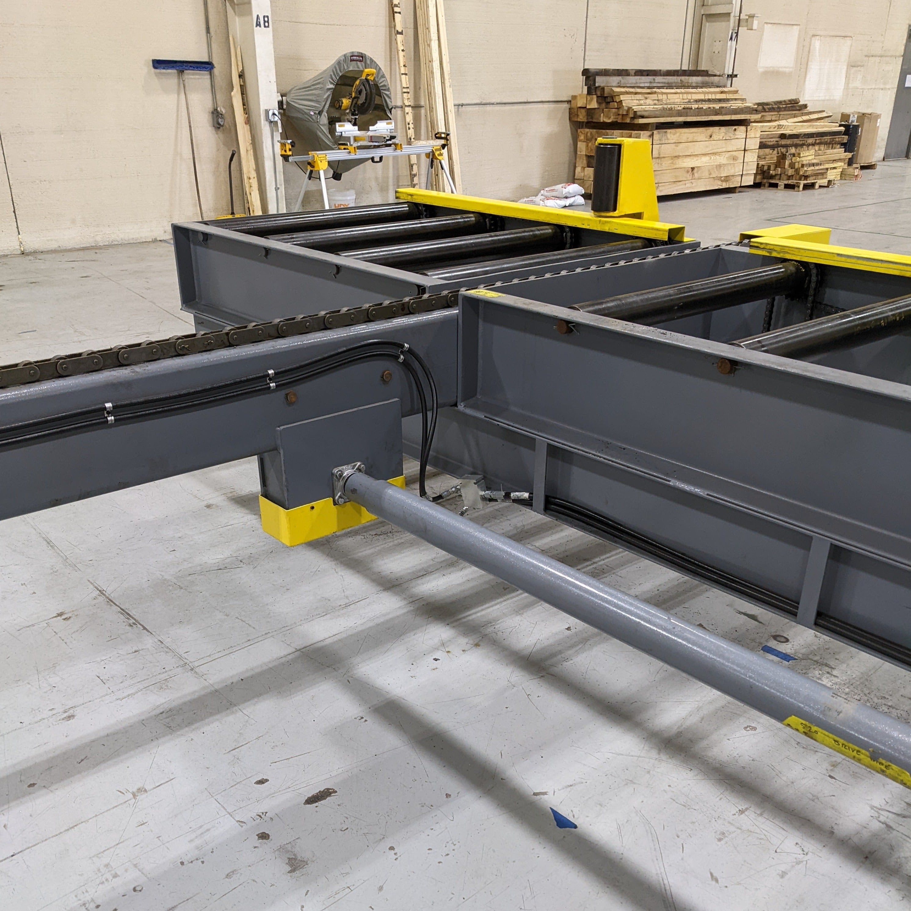 Two Saw system with powered lift transfer arms – Bad Ass Band Saws